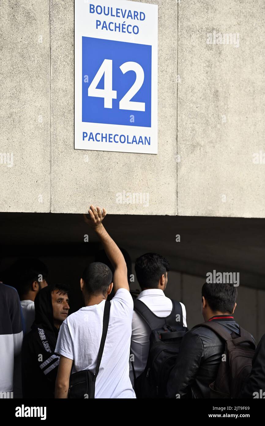 Brussels, Belgium. 29th Aug, 2022. Asylum seekers wait outside the ...