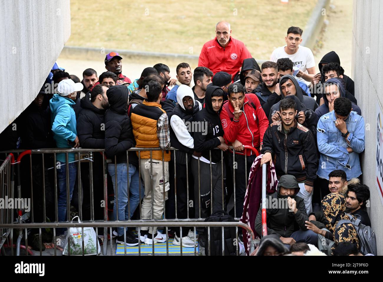 Brussels, Belgium. 29th Aug, 2022. Asylum seekers wait outside the ...