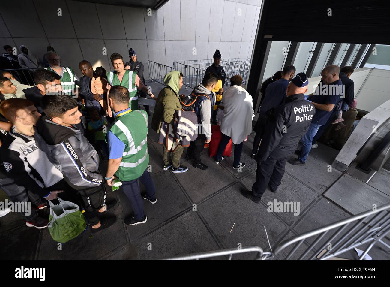 Brussels, Belgium. 29th Aug, 2022. Asylum seekers wait outside the ...