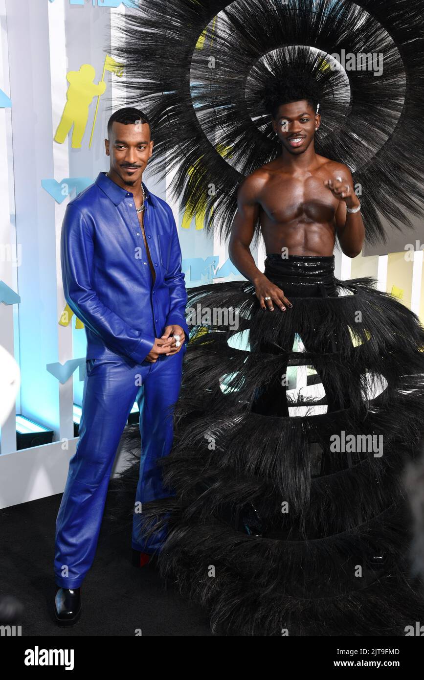 Harris Reed and Lil Nas X walking on the black carpet at the 2022 MTV ...