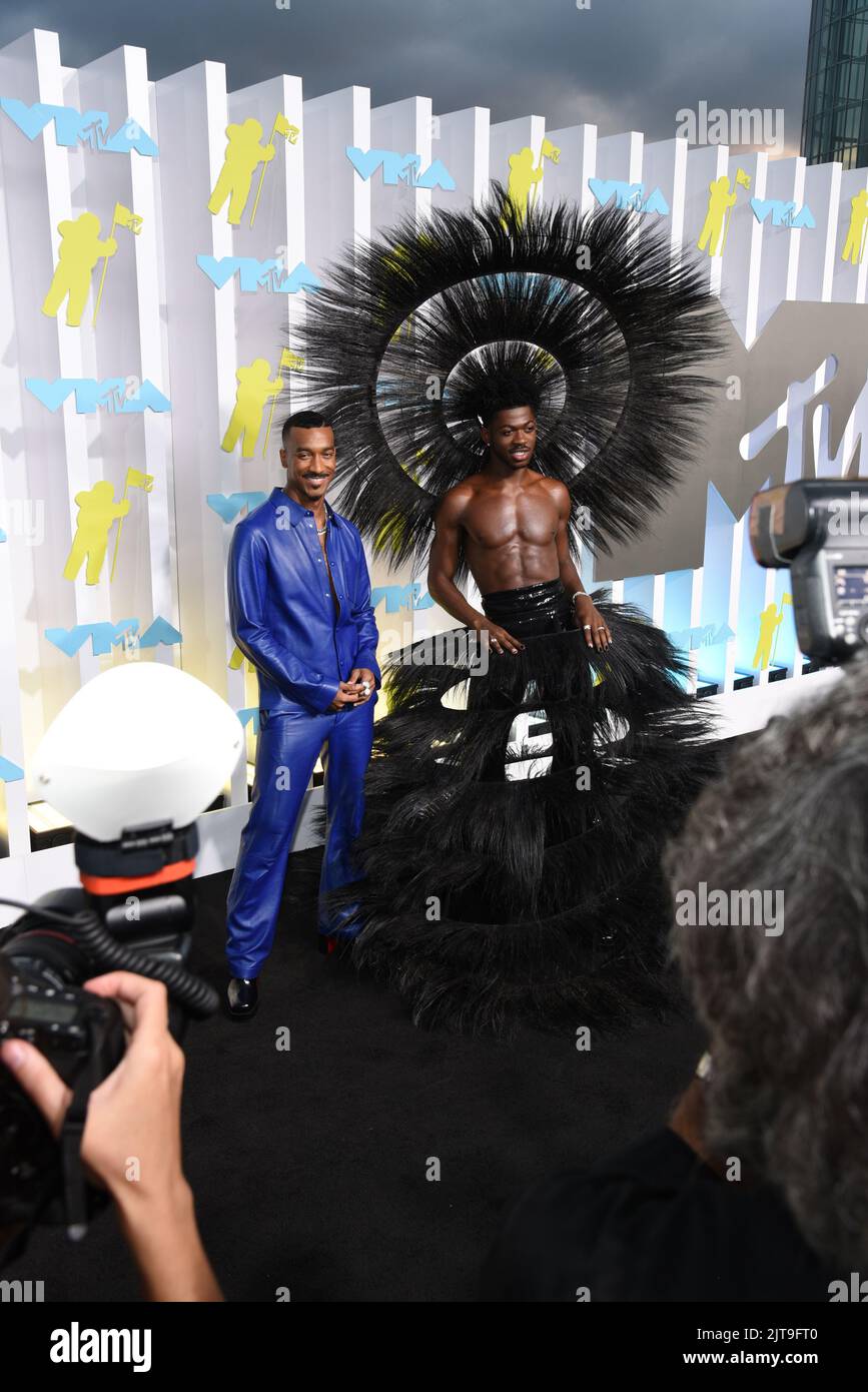 Harris Reed and Lil Nas X walking on the black carpet at the 2022 MTV ...