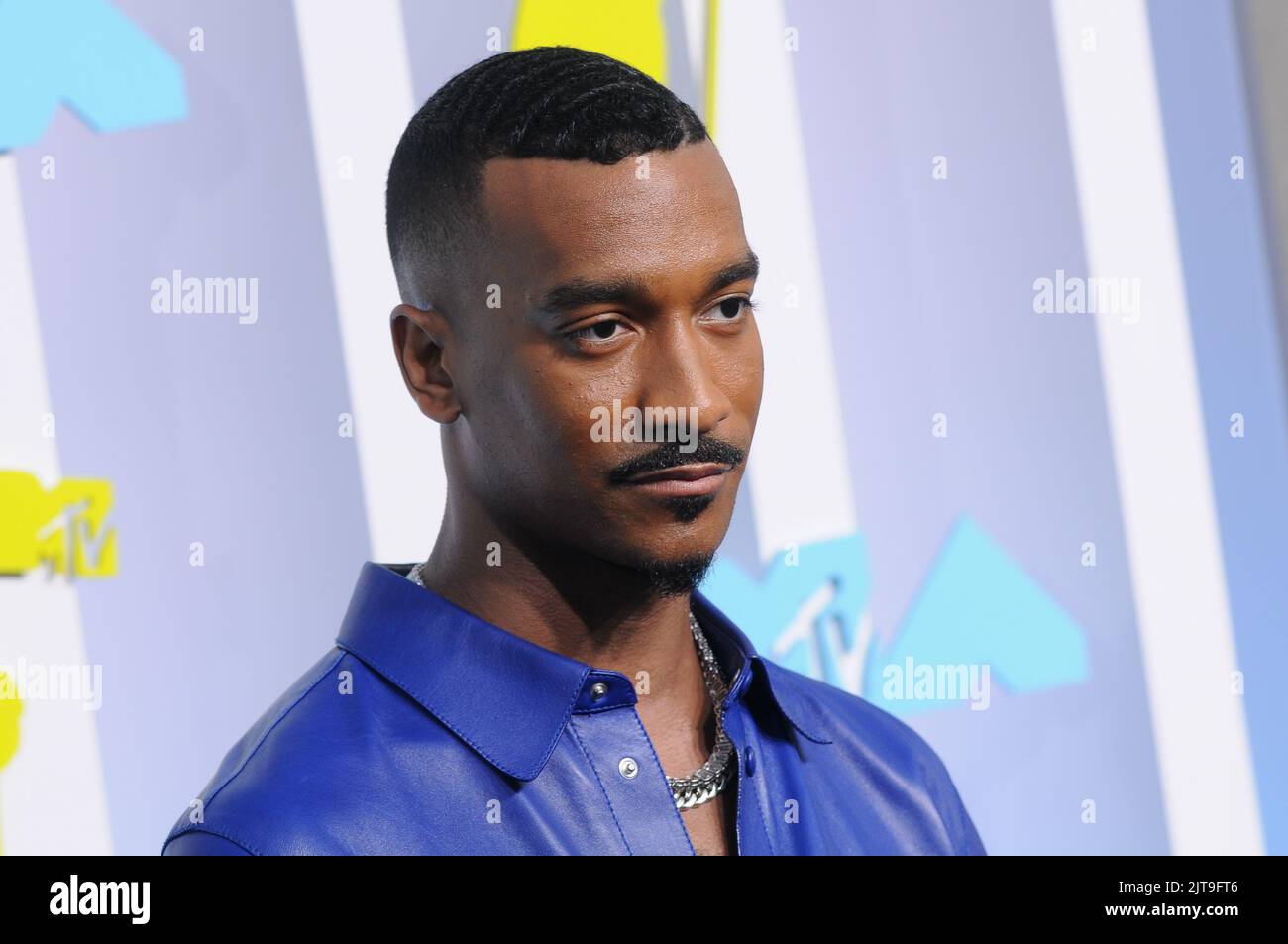 Harris Reed walking on the black carpet at the 2022 MTV Video Music ...