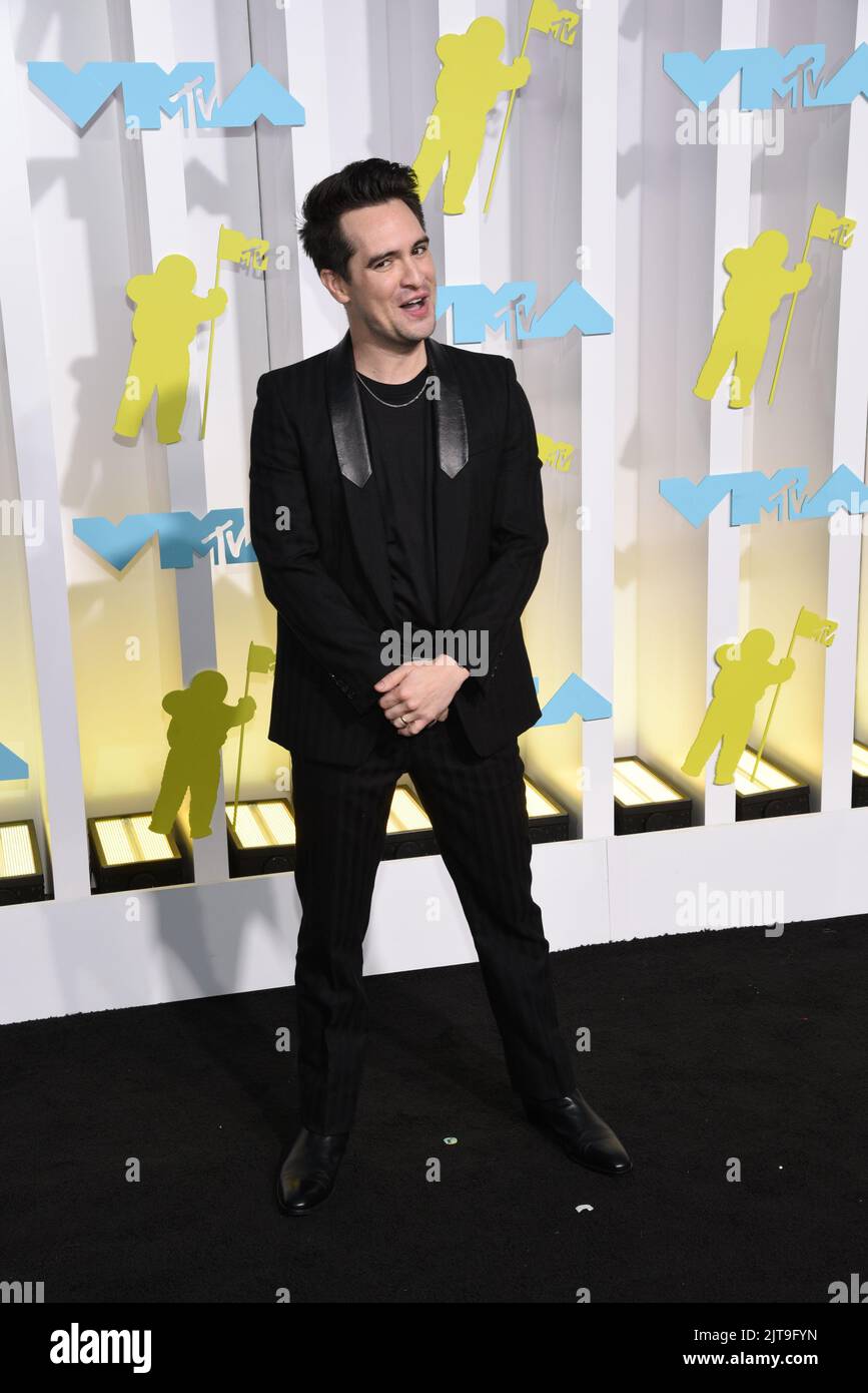 Brandon Urie of Panic at the Disco walking on the black carpet at the ...