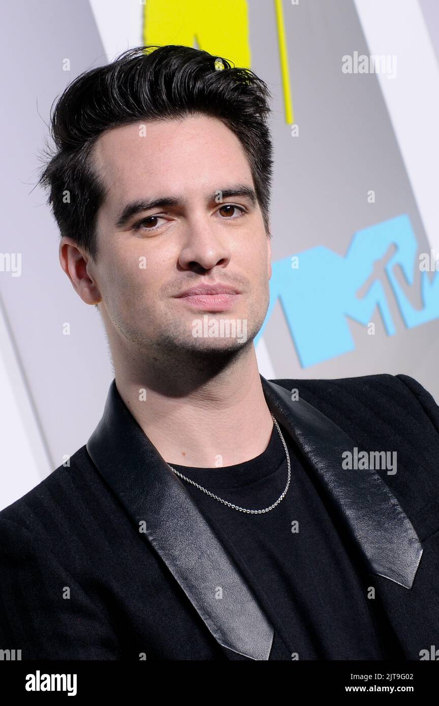 Brandon Urie of Panic at the Disco walking on the black carpet at the ...