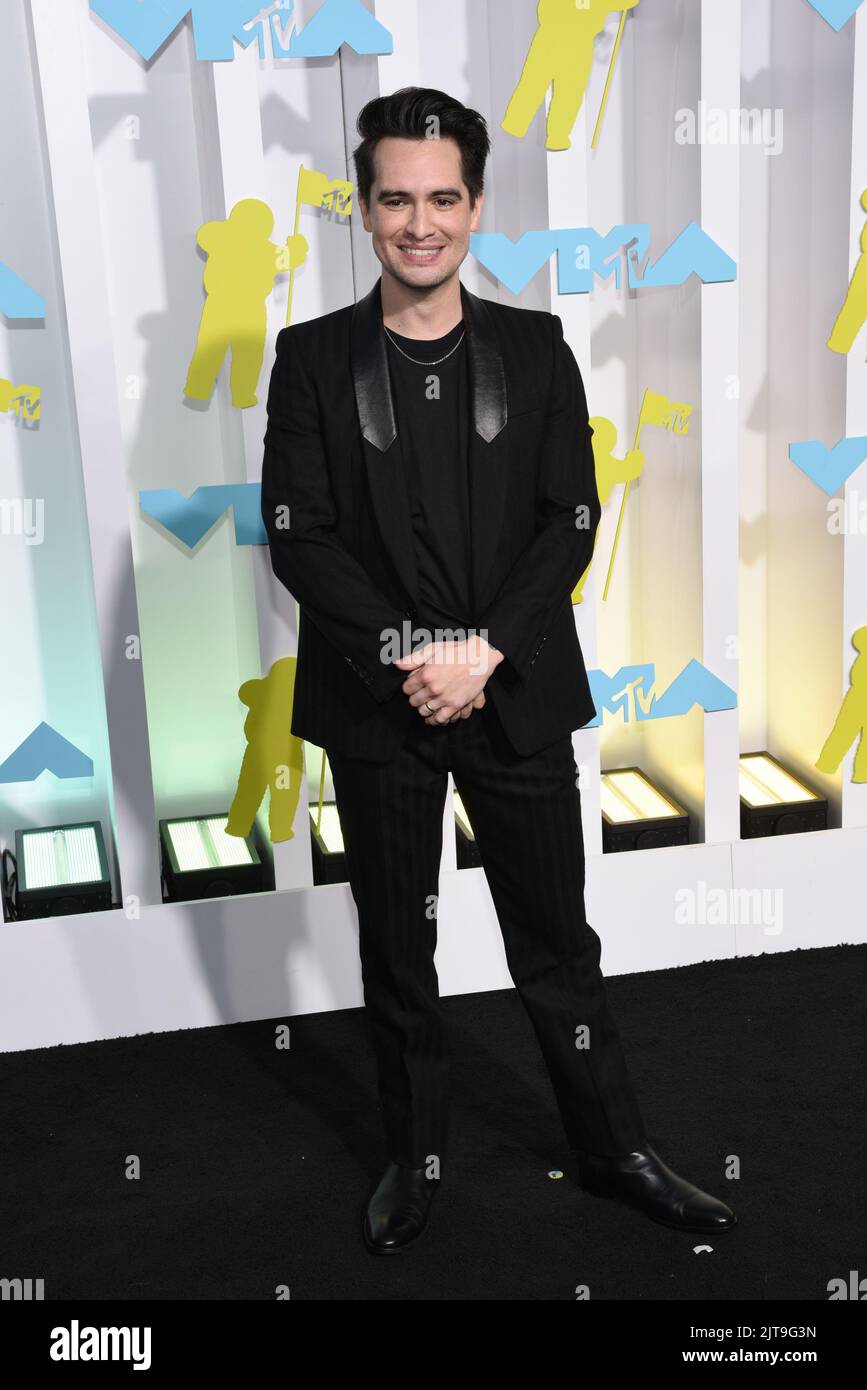 Brandon Urie of Panic at the Disco walking on the black carpet at the ...