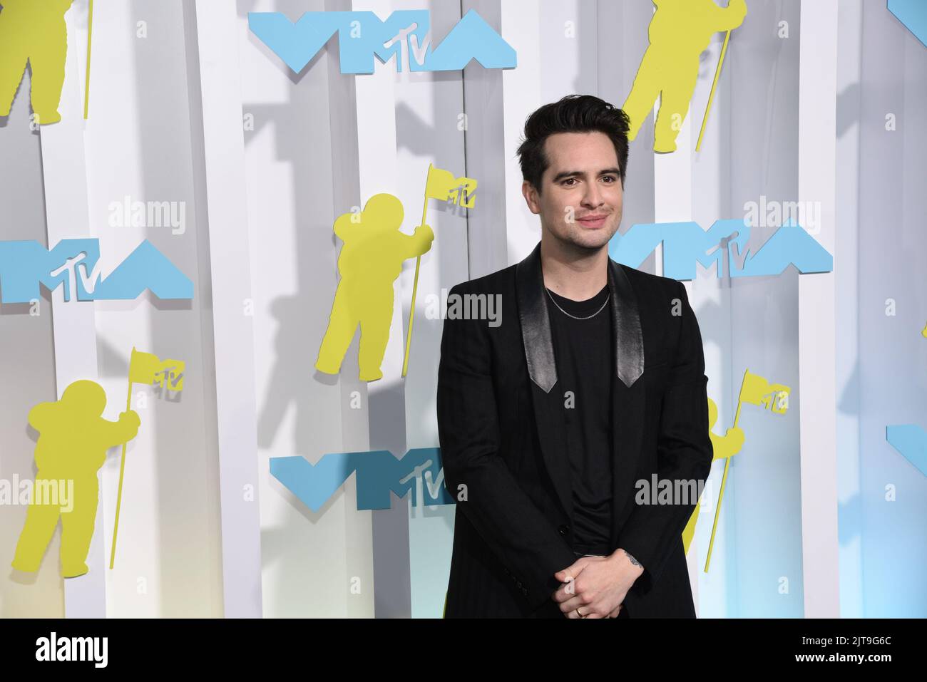Brandon Urie of Panic at the Disco walking on the black carpet at the ...