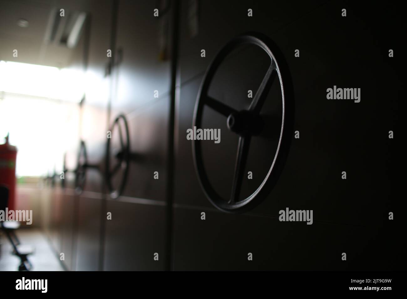 Moving cabinets in low light environment Stock Photo - Alamy