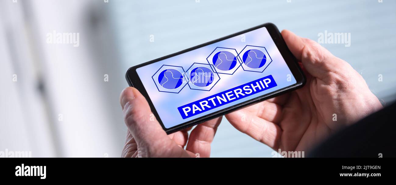 Smartphone screen displaying a partnership concept Stock Photo - Alamy