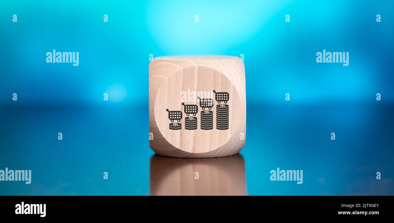 Wooden block with symbol of inflation concept on blue background Stock ...