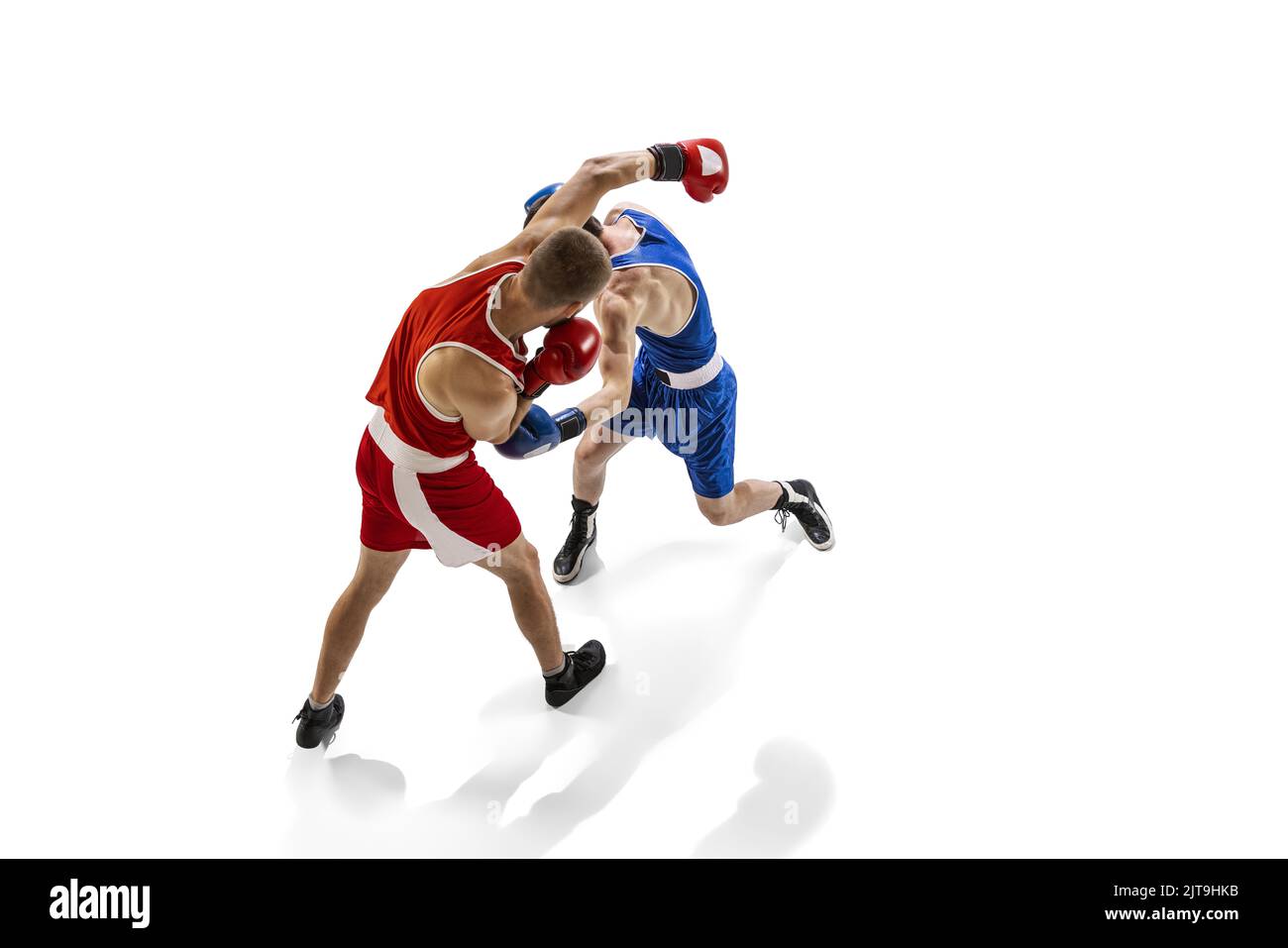 Young men, professional boxers in sports uniform boxing isolated on ...