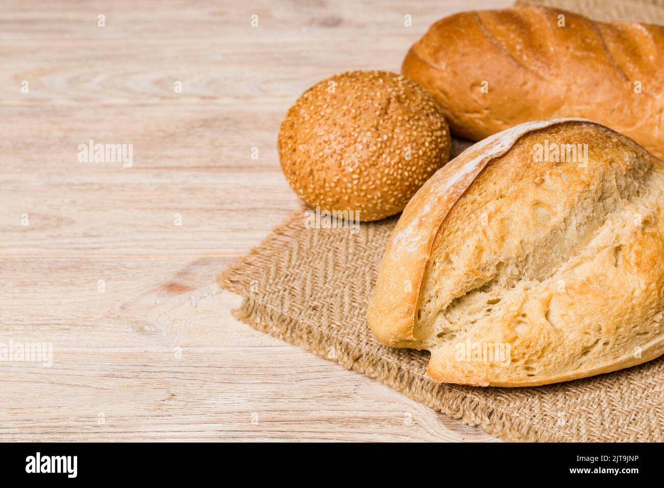 Homemade natural breads. Different kinds of fresh bread as background ...
