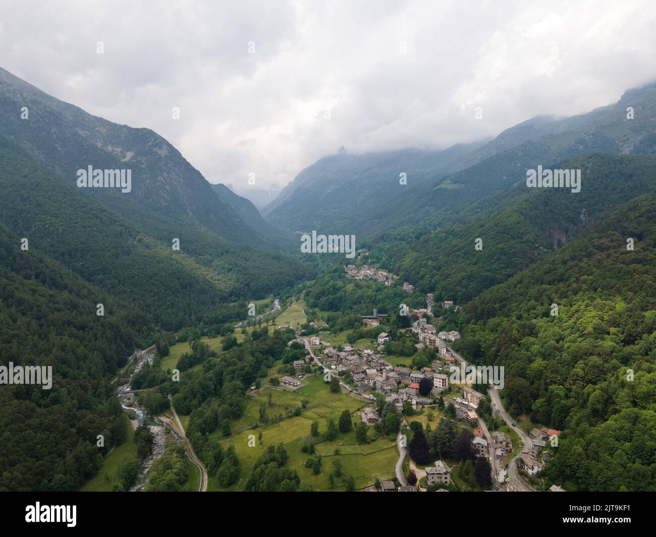A bird's eye view of an old village in green mountains in Italy Stock ...