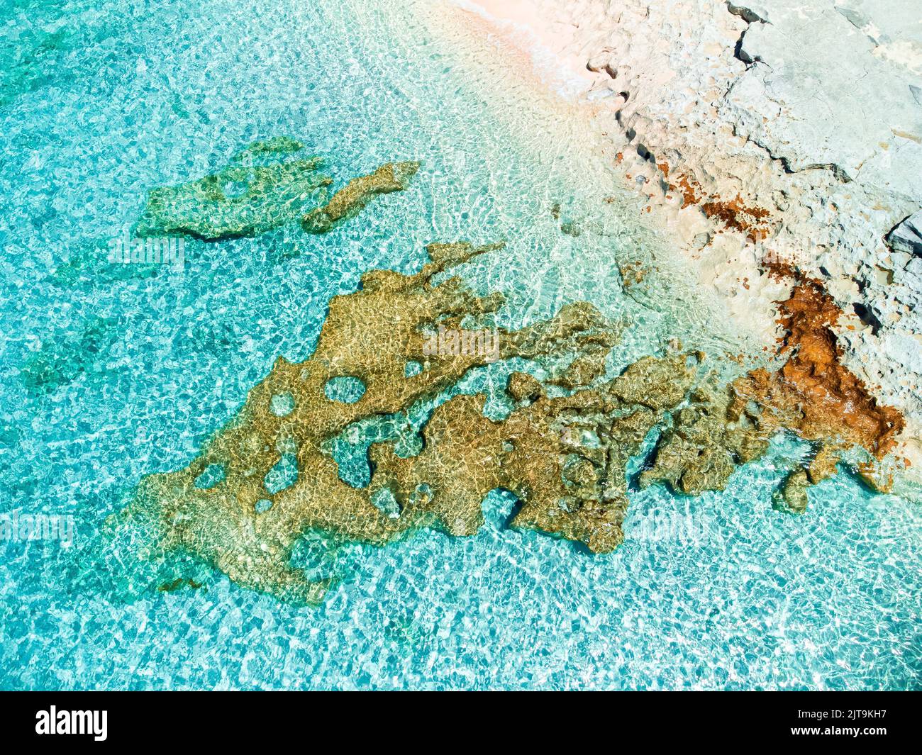 An aerial top view of a beautiful beach against turquoise sea in San ...