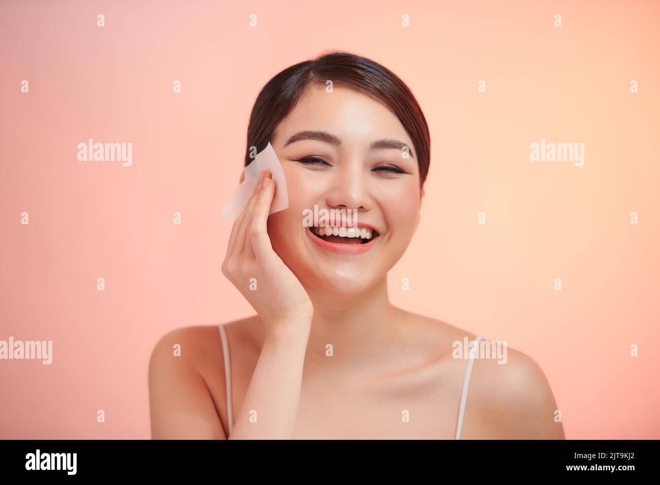 Woman blotting face hi-res stock photography and images - Alamy