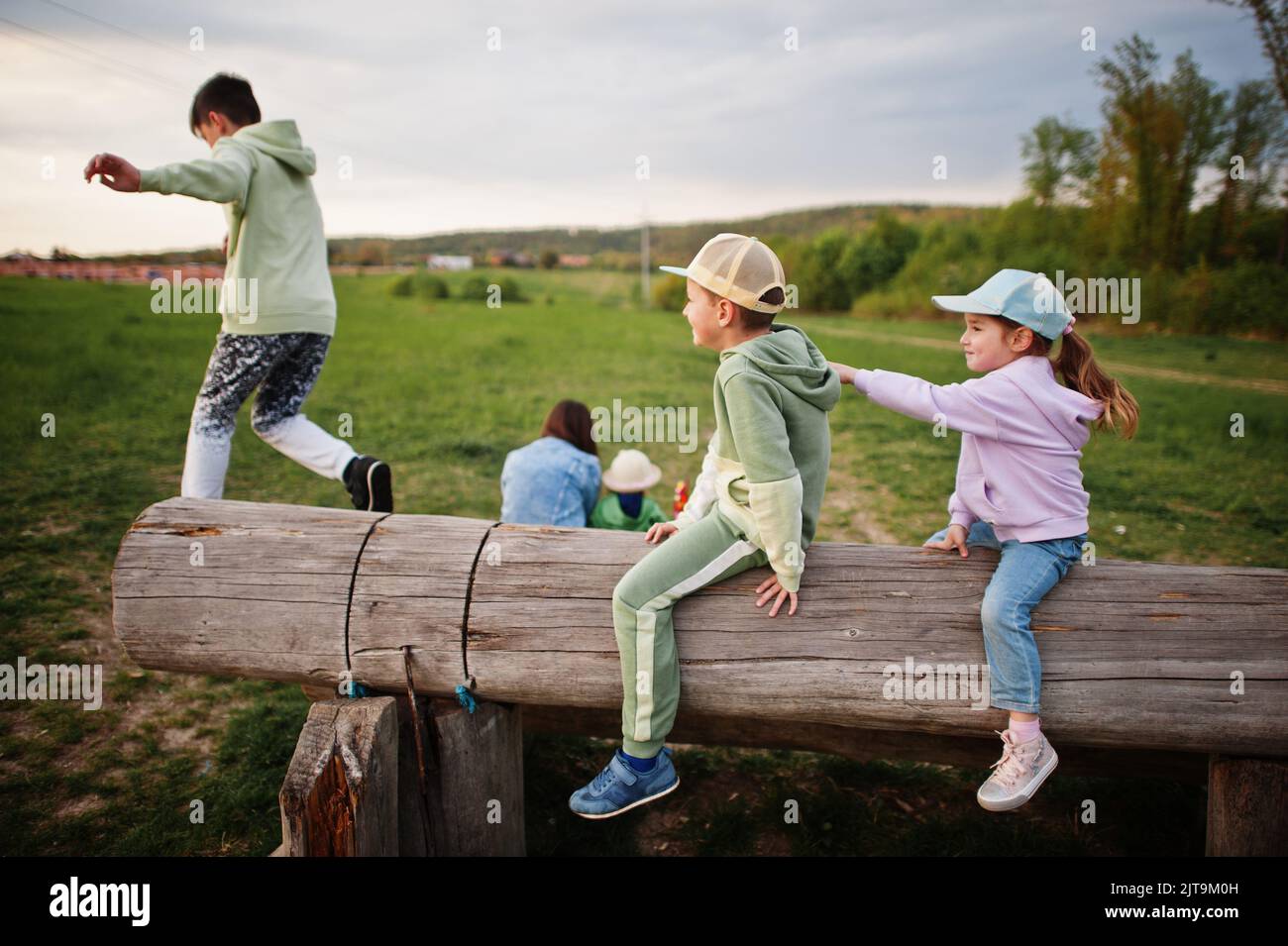 Children having fun together at meadow Stock Photo - Alamy