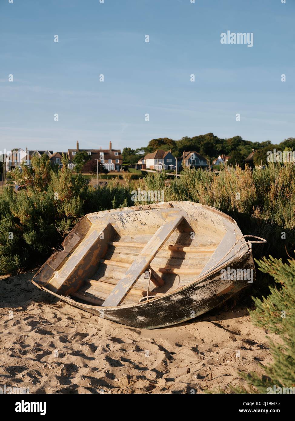 A rowing boat in the salt marsh summer landscape of West Mersea, Mersea ...