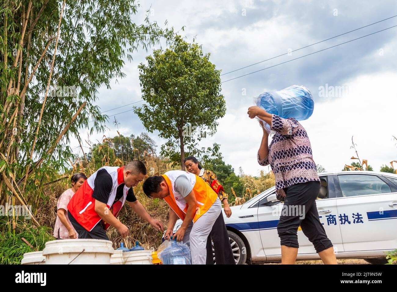 CHONGQING, CHINA - AUGUST 29, 2022 - Cadres deliver water to villagers ...