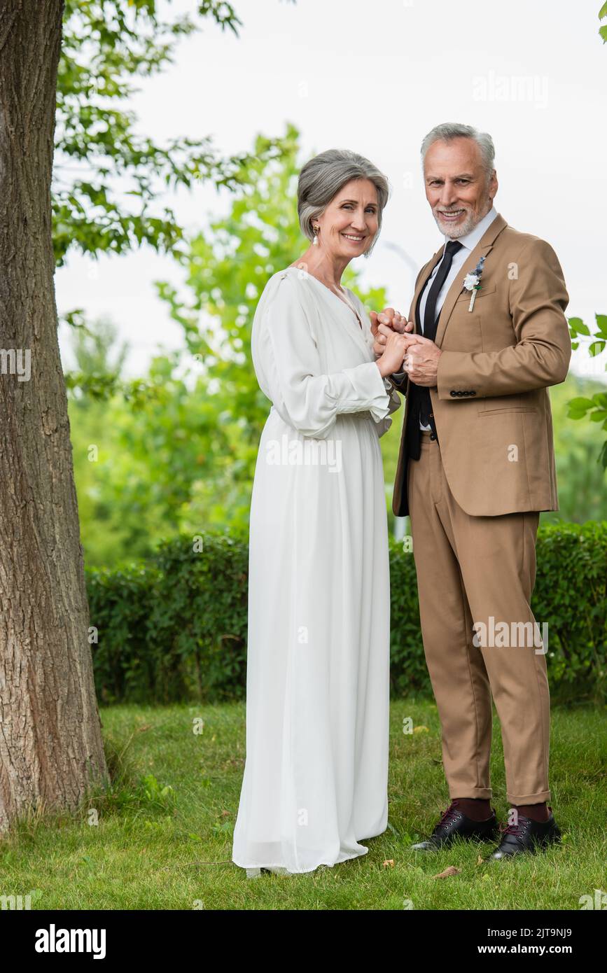 Beautiful mature woman white dress hi-res stock photography and images ...