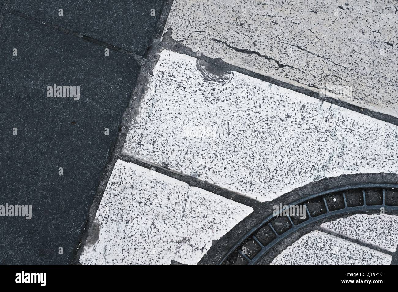 White and dark lines of crossing in the city, closeup, road texture and ...