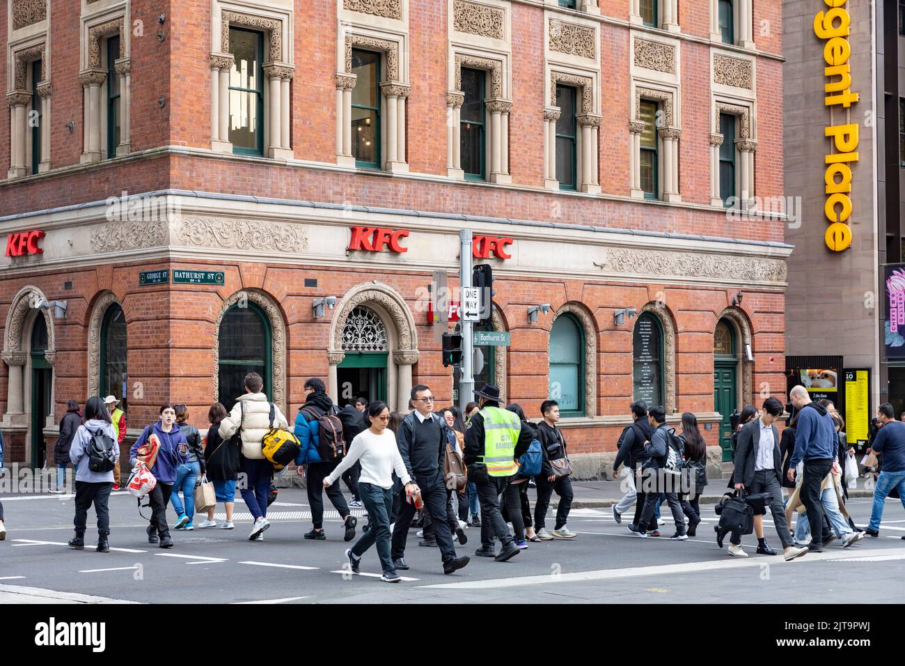 Sydney city centre, people crossing busy road intersection beside KFC ...