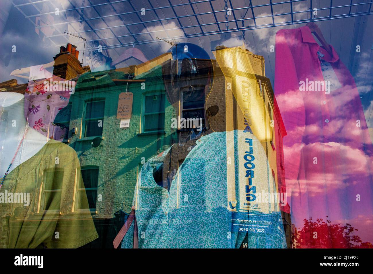 Reflections in shop window in West London Stock Photo - Alamy