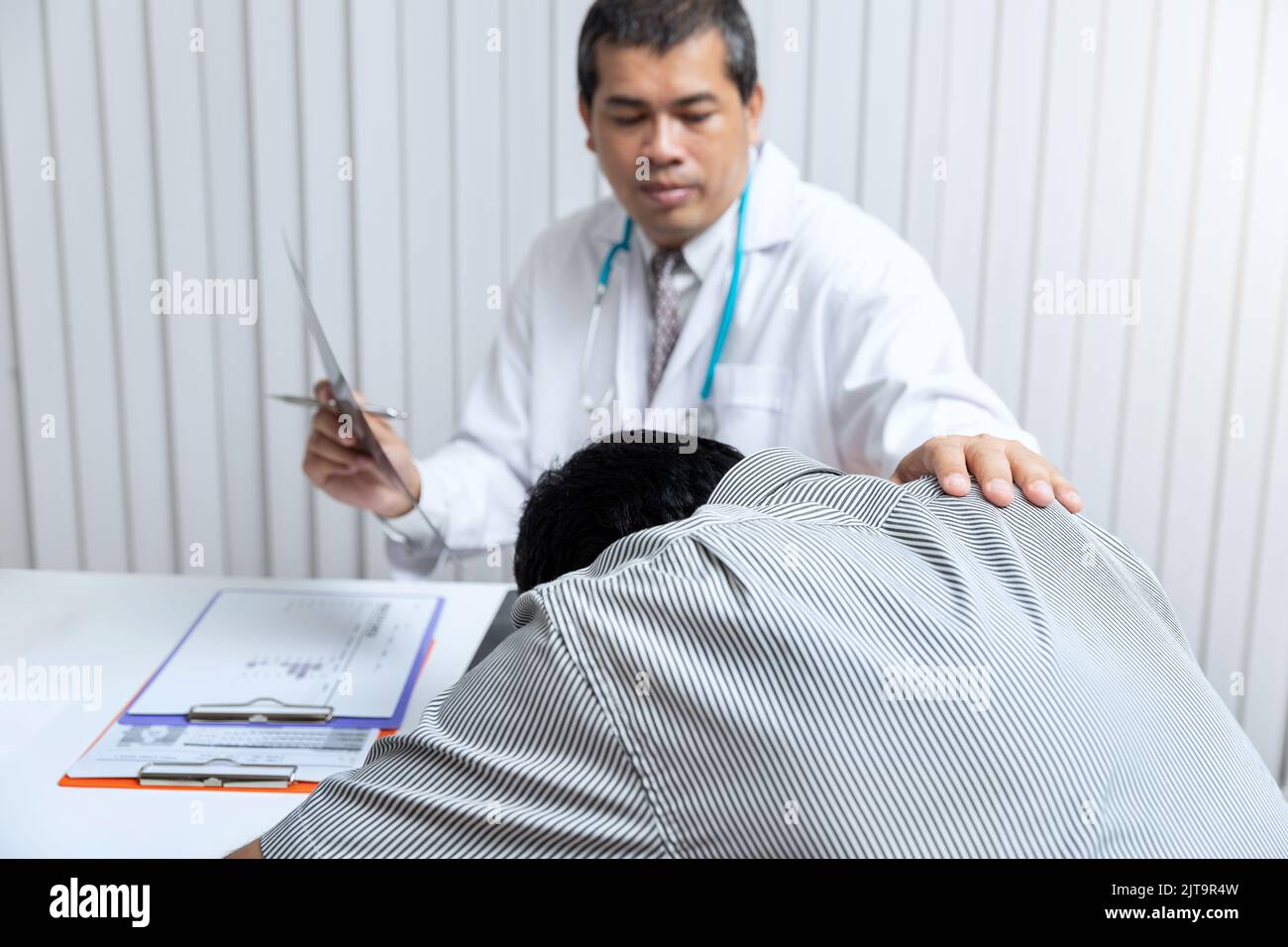 Medical consultation. Doctor soothing a patient fear depressed and fail ...