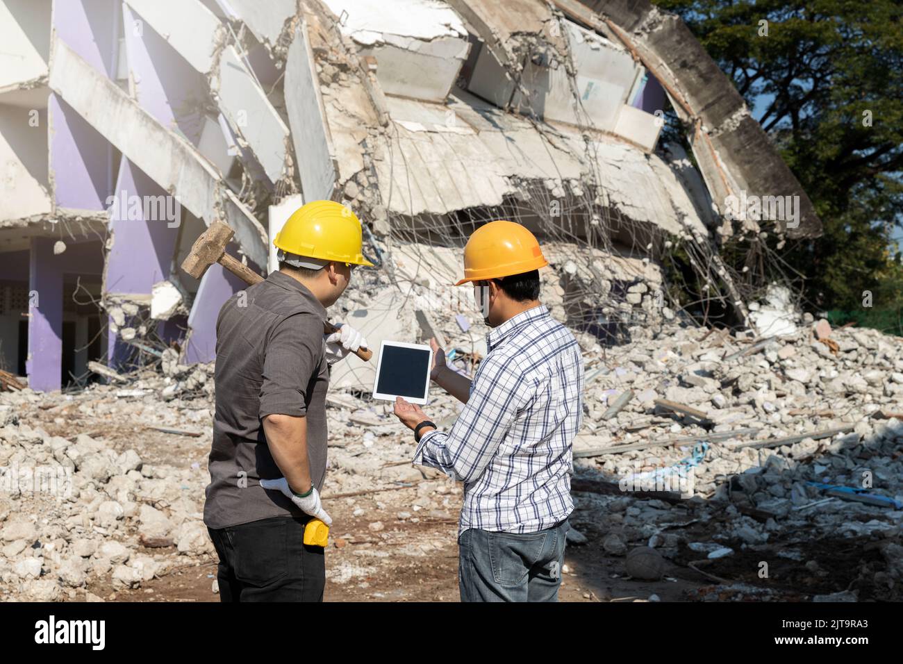 Demolition control supervisor and foreman discussing on demolish ...