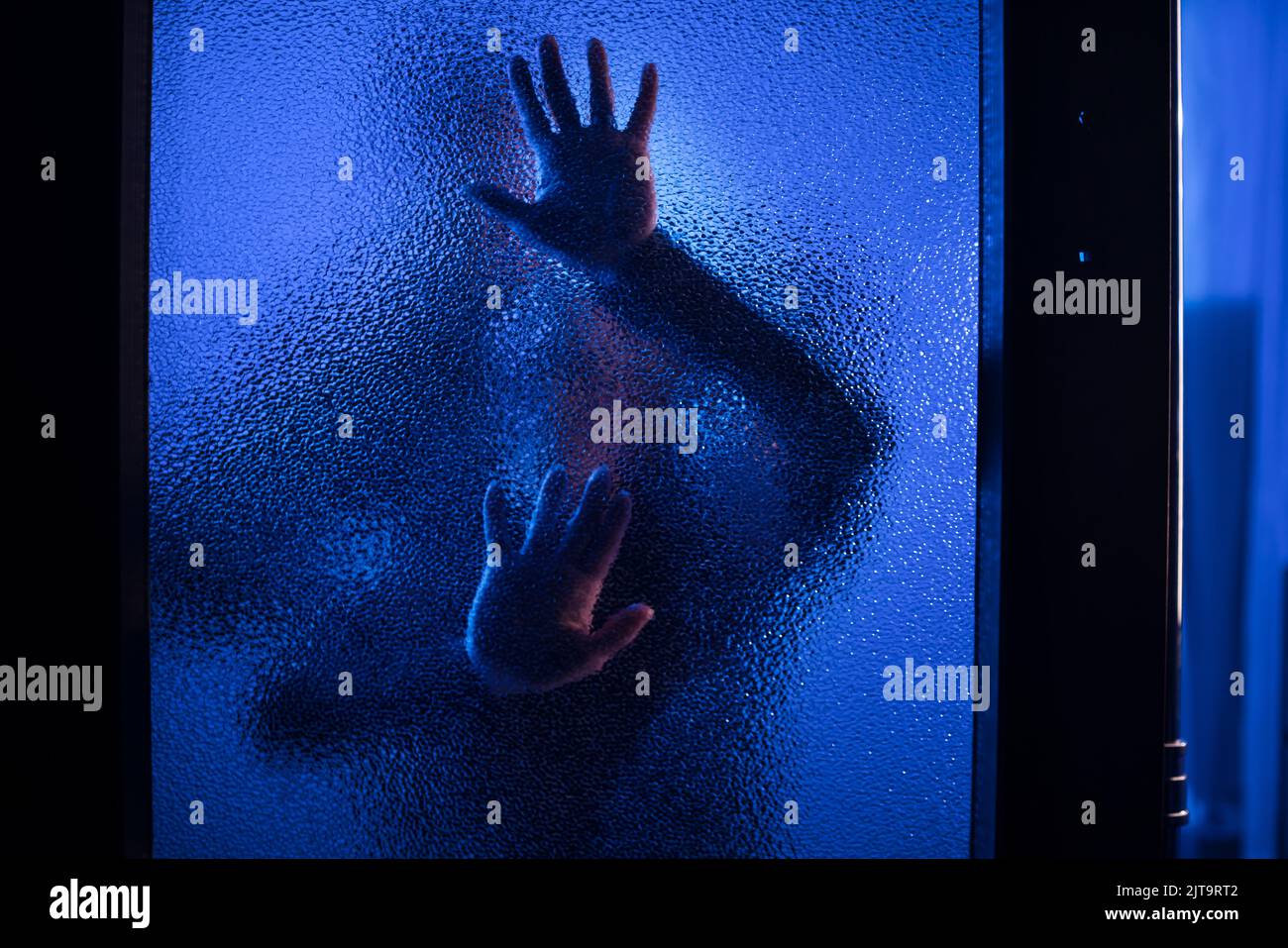 Shadow of woman screaming behind the glass, domestic violence concept ...