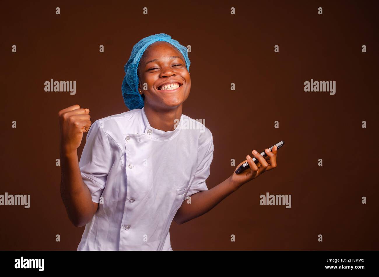 excited african using her cellphone Stock Photo - Alamy