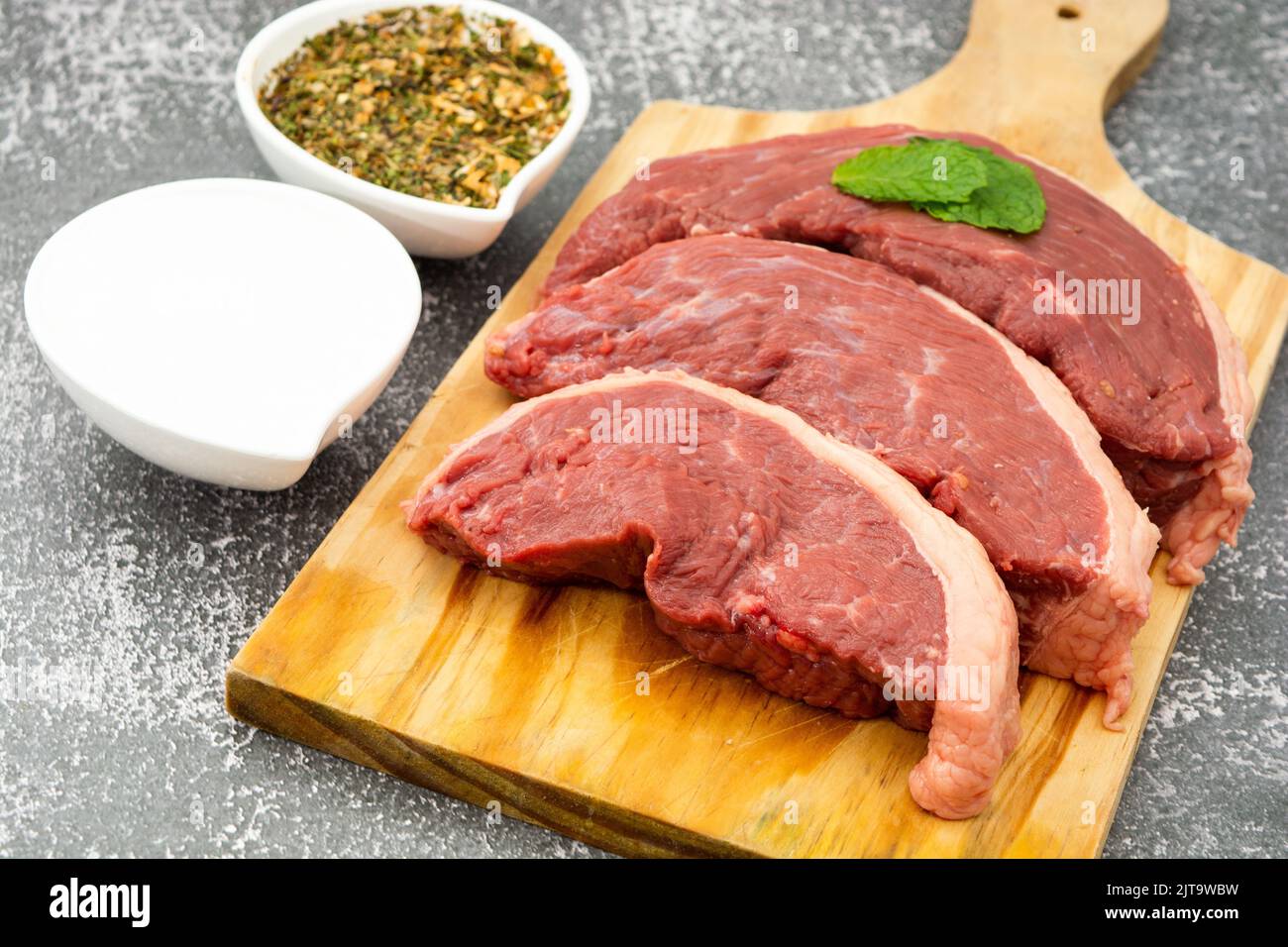 raw picanha steaks and seasoning, high angle Stock Photo - Alamy
