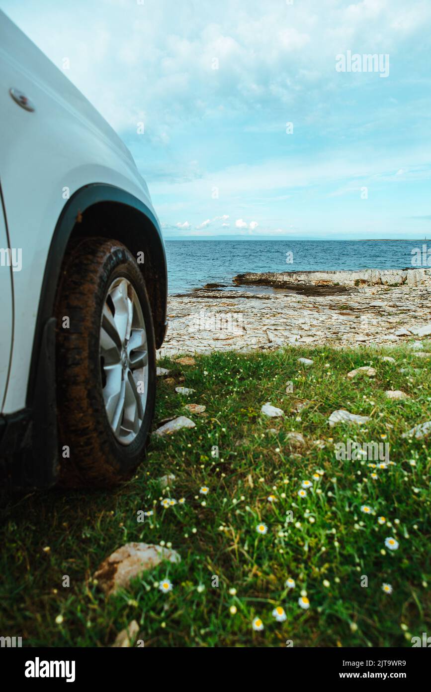 car travel concept suv at seaside with dirty wheels Stock Photo - Alamy