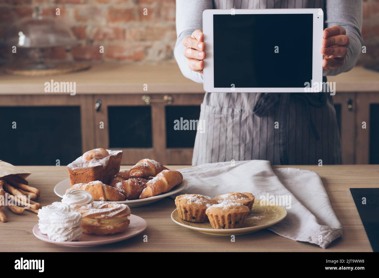 cooking advertisement culinary class man tablet Stock Photo - Alamy