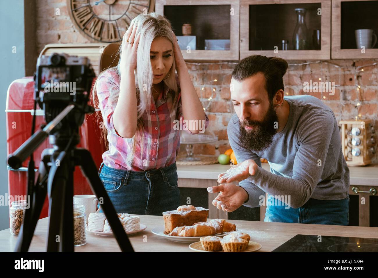 family cooking vlogging hobby bakery camera tripod Stock Photo - Alamy