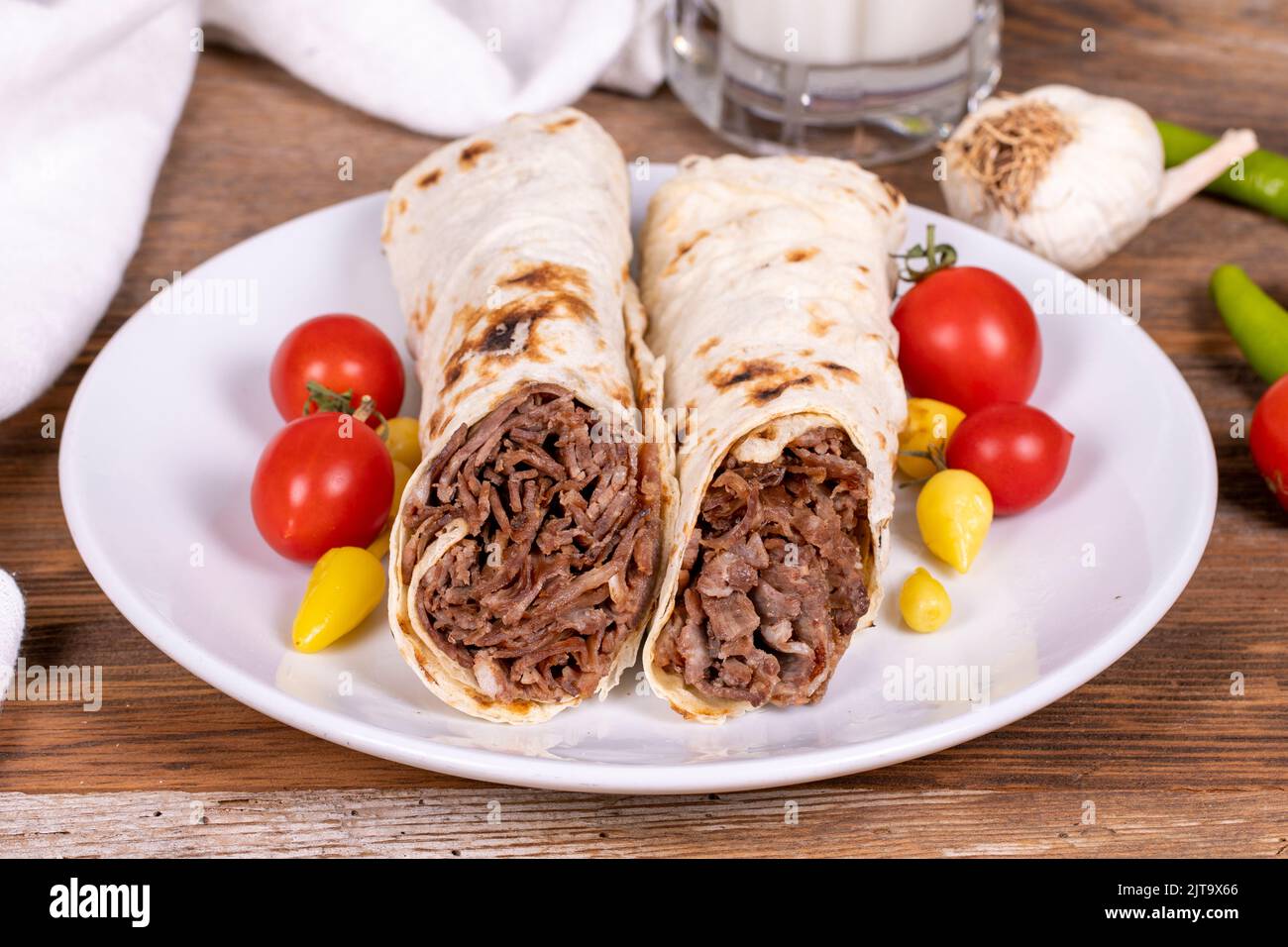 Wrap Doner Kebab. Meat doner kebab on wooden background. Traditional ...