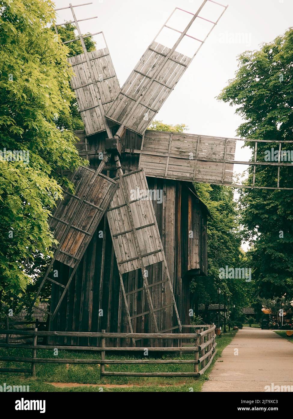 A vertical shot of aa wooden wind mill Stock Photo - Alamy