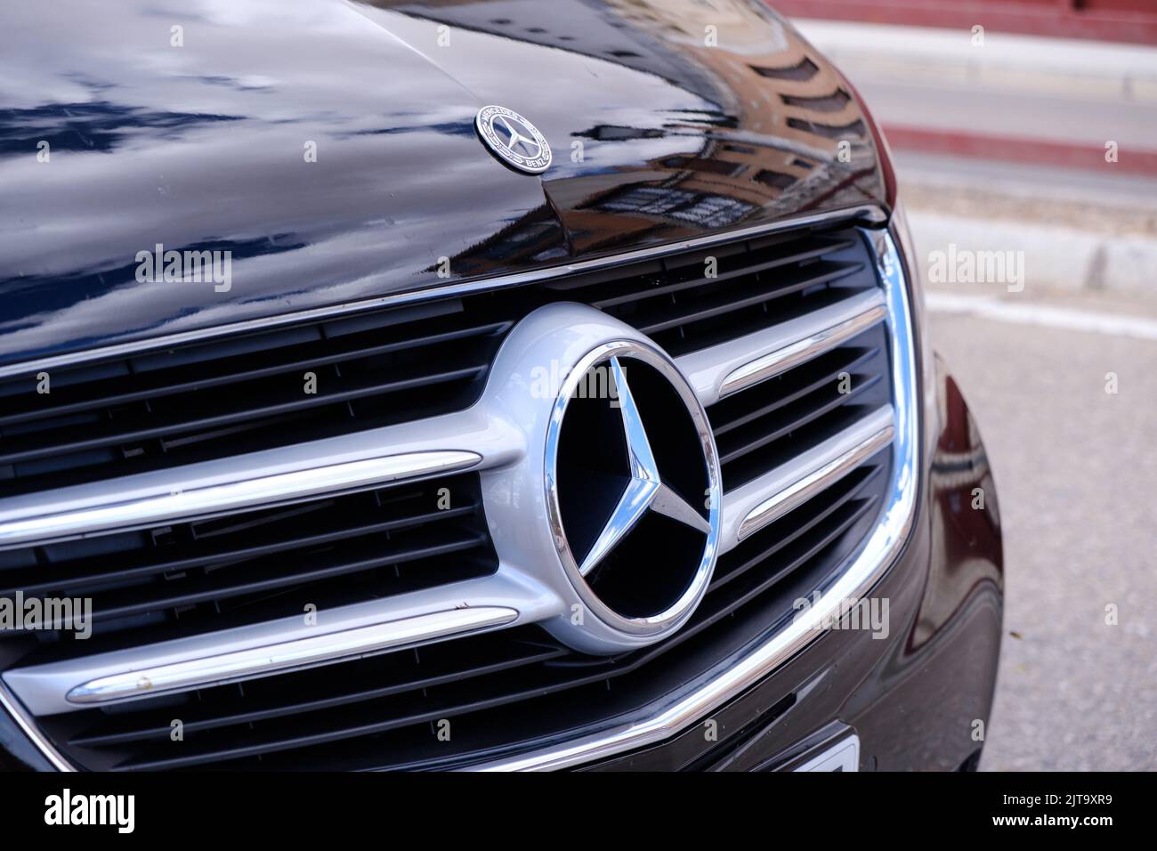 front front part of a black mercedes benz vehicle. Detail of the logo ...