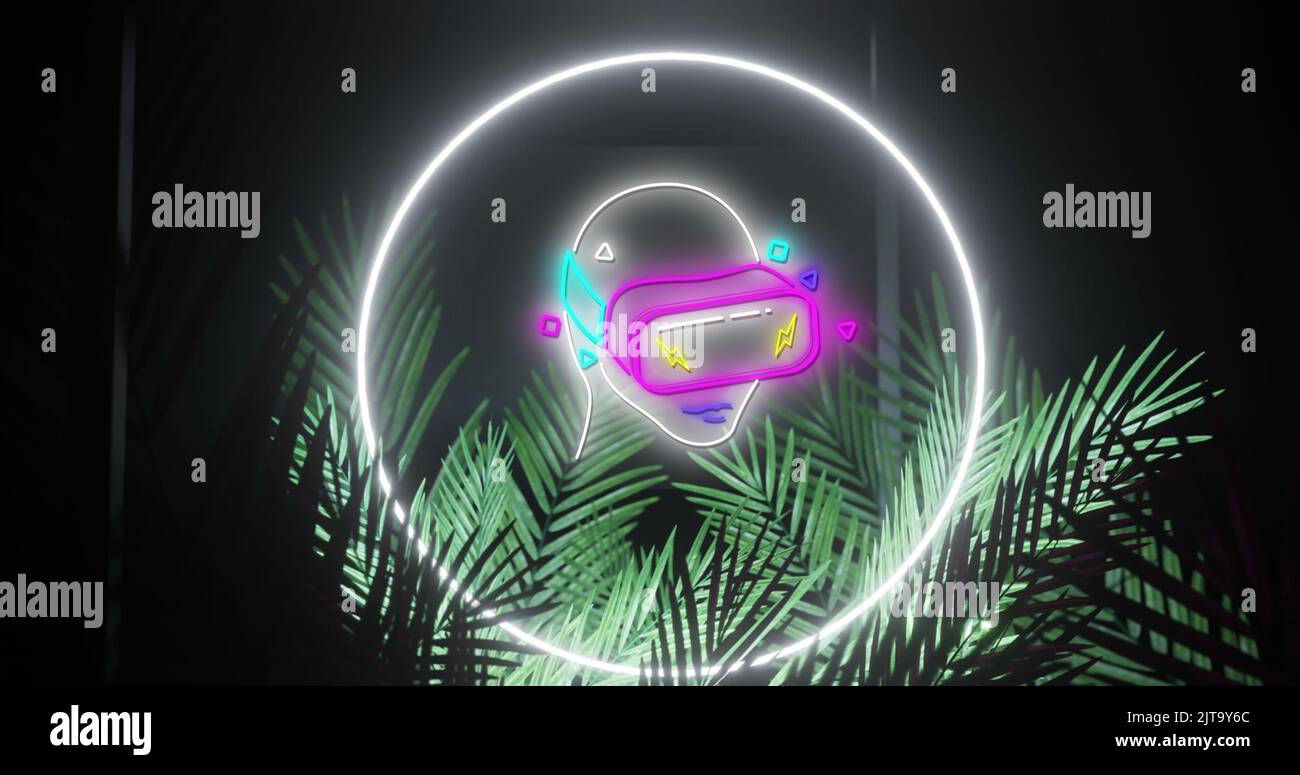 Image of neon head in vr headset and ring in white neon, over palm leaves on black background ...