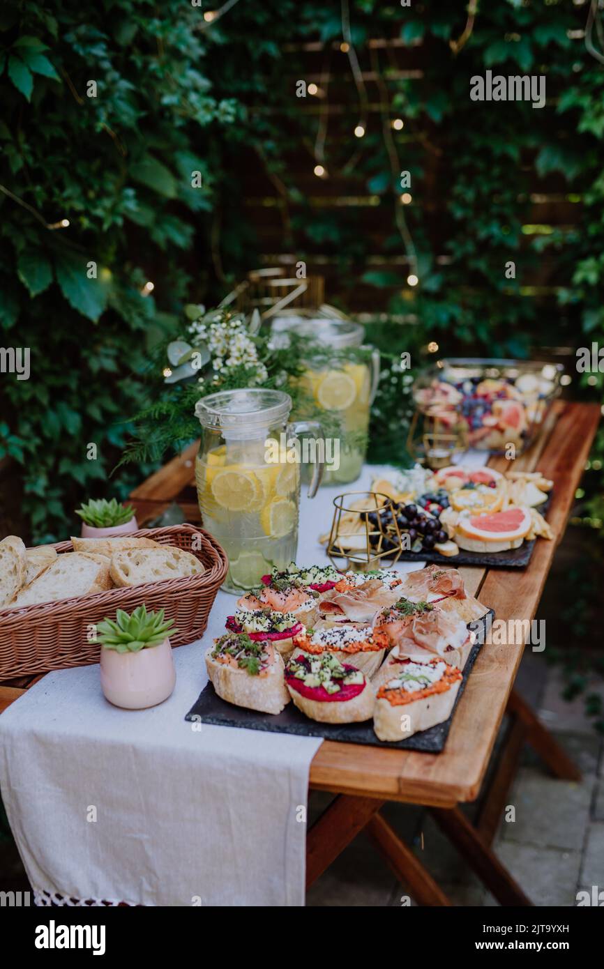 Dessert buffet at small wedding reception outside in the backyard Stock ...