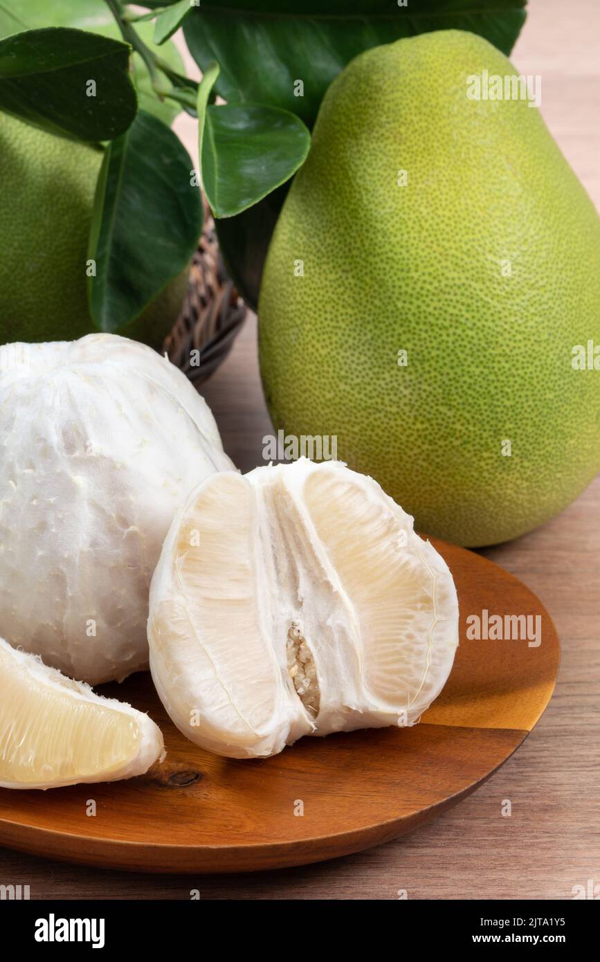 Close up of fresh peeled pomelo on wooden table background for Mid ...