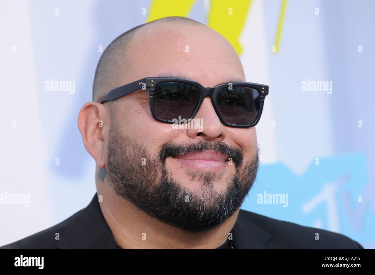 Nikko Hurtado walking on the black carpet at the 2022 MTV Video Music ...