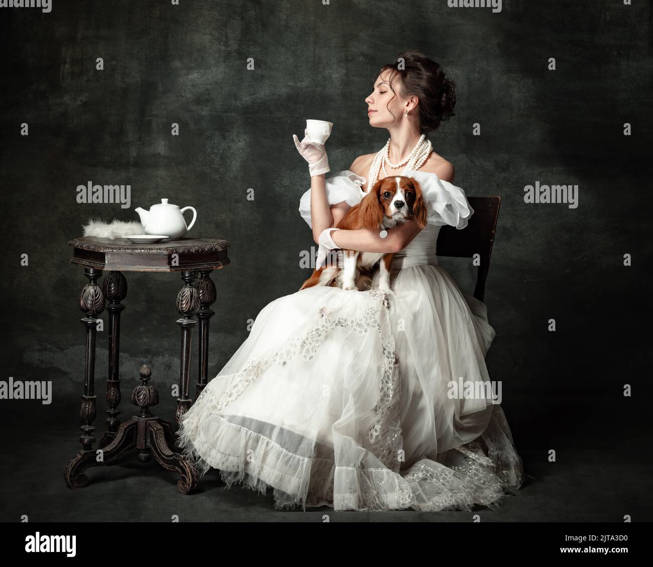 Tea time. Lady with dog. Vintage portrait of young elegant woman in ...