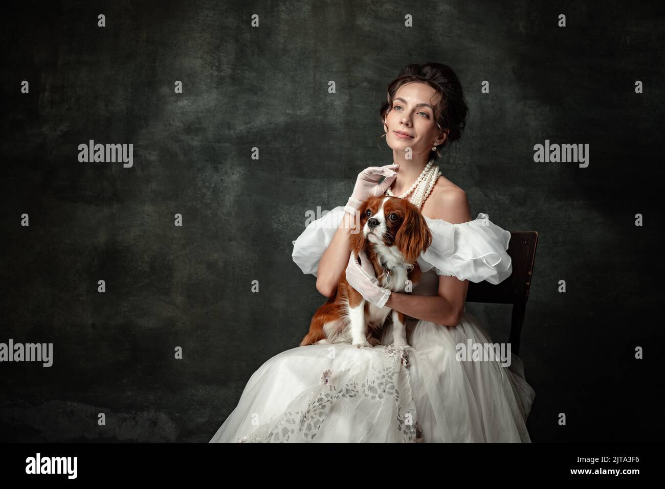 Charm and grace. Vintage portrait of young elegant woman in image of ...