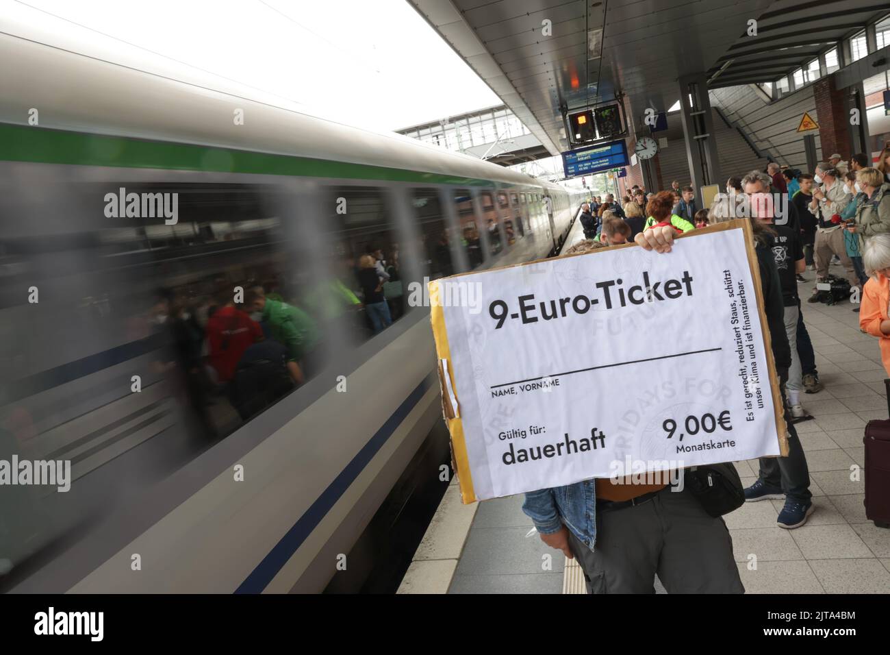Berlin, Germany. 29th Aug, 2022. A demonstrator stands with an ...