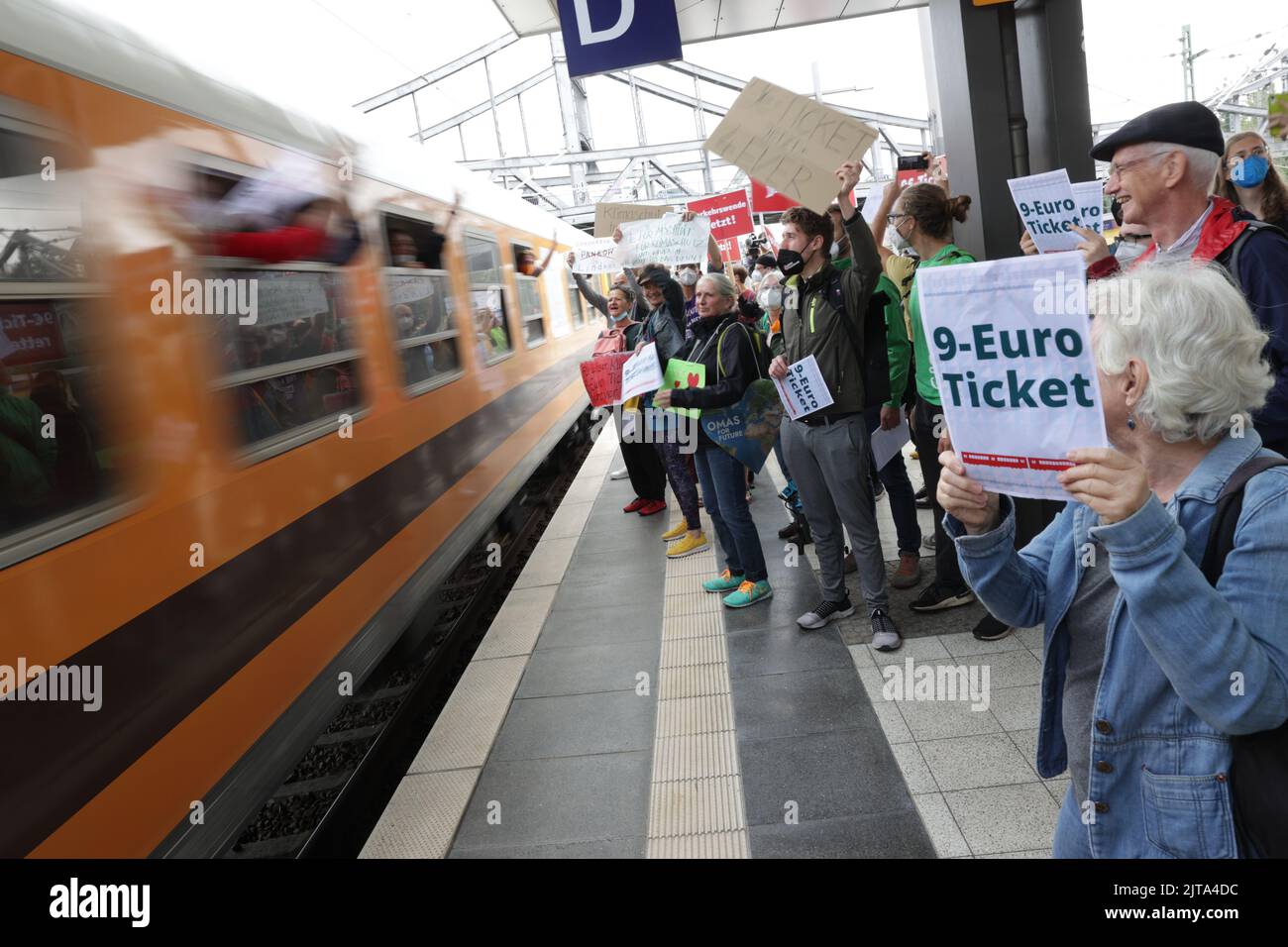 Berlin, Germany. 29th Aug, 2022. Demonstrators stand with banners in ...