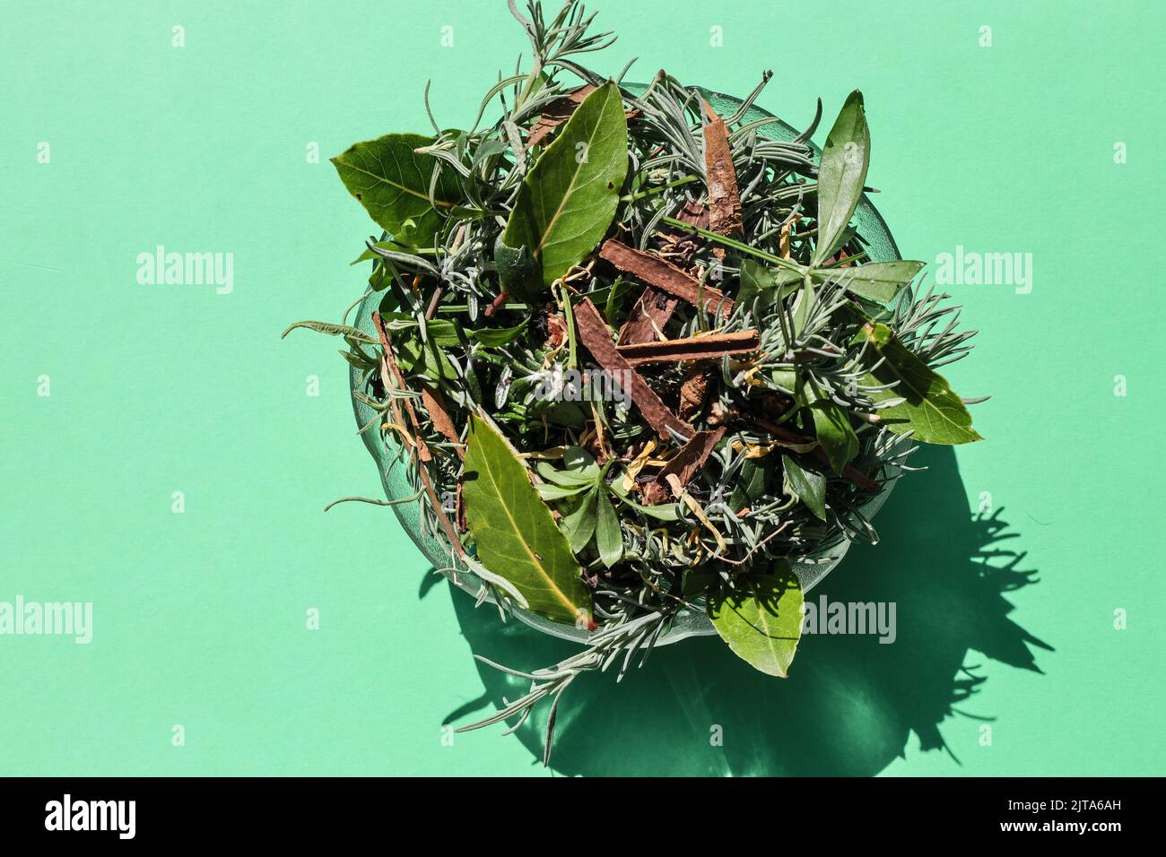 A simple glass bowl of fresh natural potpourri photographed from above ...