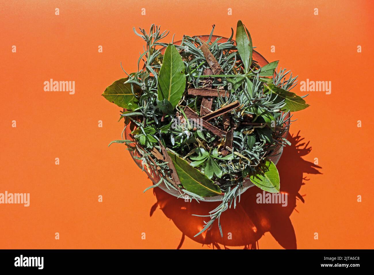 A simple glass bowl of fresh natural potpourri photographed from above ...