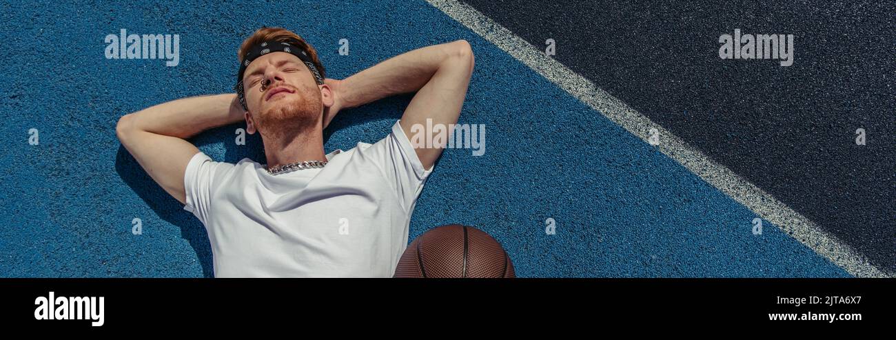 Young man lying on basketball hi-res stock photography and images - Alamy