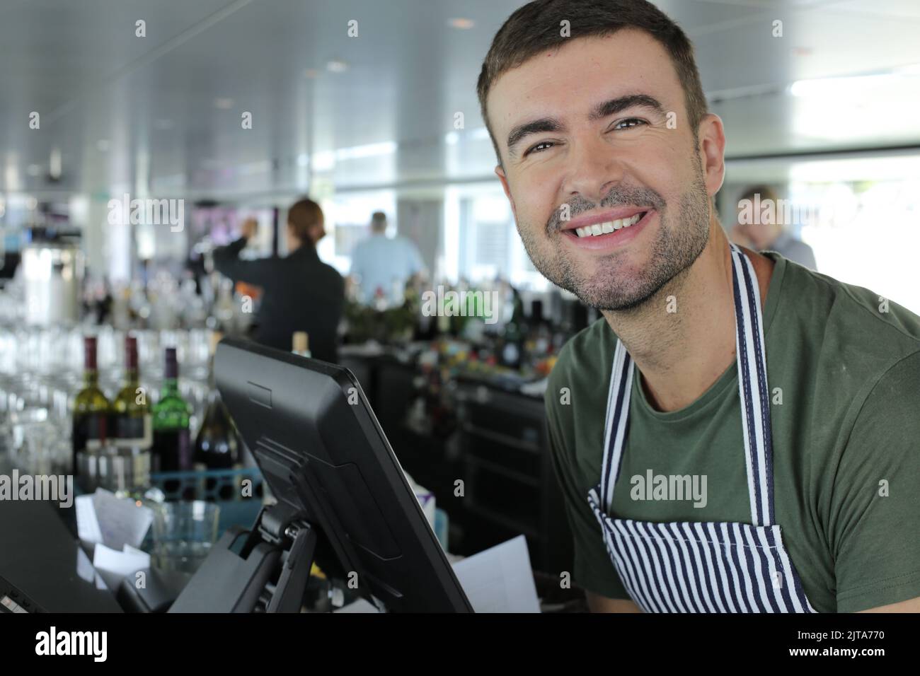 Restaurant cashier in front of computer Stock Photo - Alamy