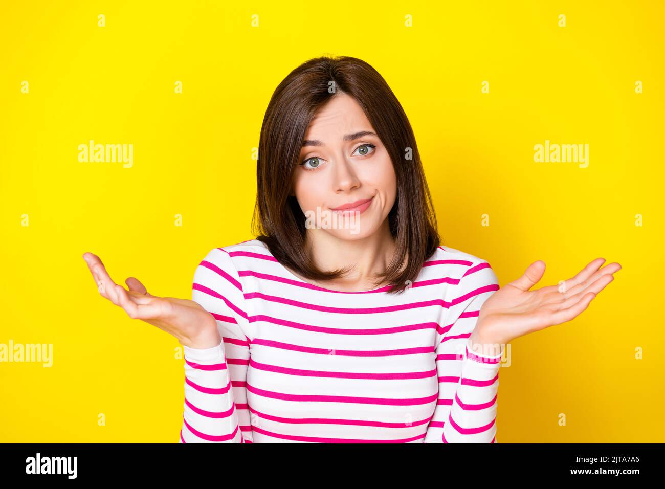 Closeup photo of young attractive confused lady dont know what can help ...