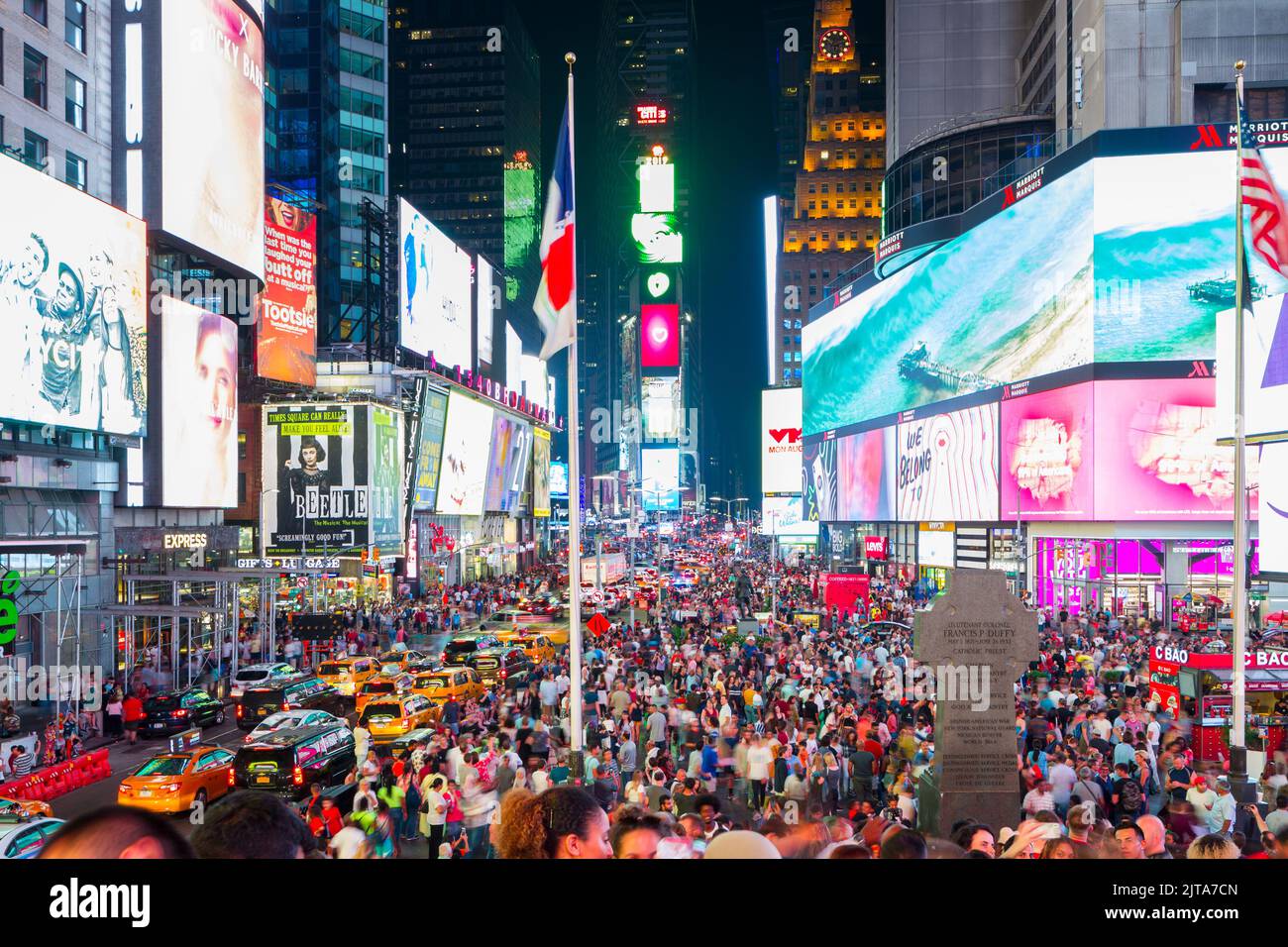 Large crowds gathered by night in Times Square in Midtown Manhattan ...